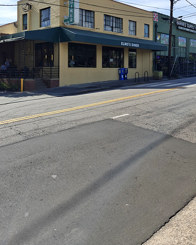 The unassuming yellow brick exterior of Elmo's Diner stands like a beacon of breakfast hope on Durham's Ninth Street.