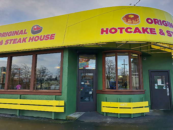 The unmistakable yellow and green exterior of Original Hotcake House stands like a breakfast beacon in Portland, promising comfort food salvation 24 hours a day.