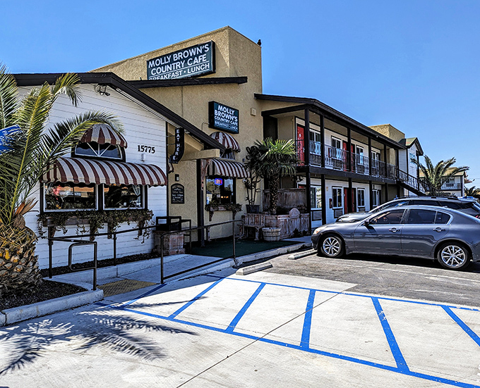 The unassuming exterior of Molly Brown's Country Cafe, with its charming striped awnings, promises comfort food treasures within. Desert dining at its finest!