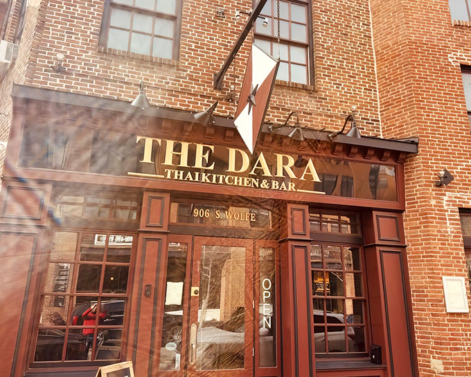 The Dara's brick facade and distinctive star logo announce its presence on Wolfe Street like a culinary beacon in Baltimore's historic landscape.