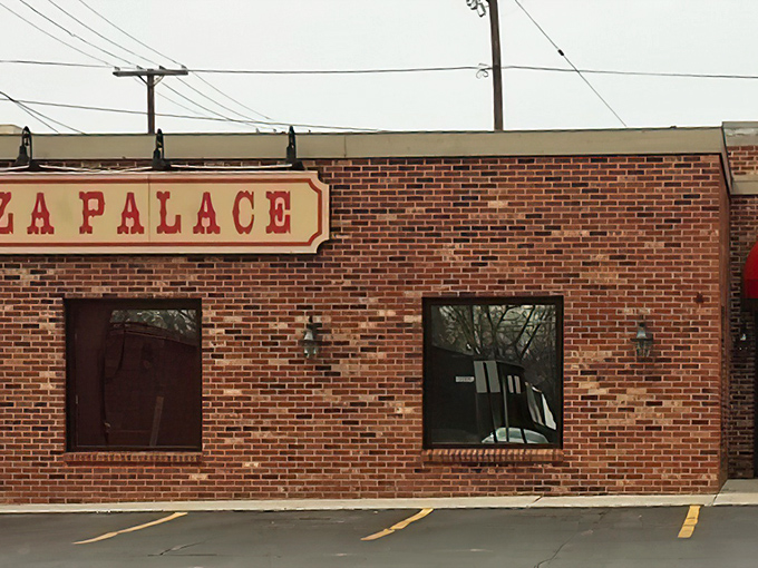 The brick facade of Fort Ball Pizza Palace stands as a testament to Tiffin's enduring love affair with no-nonsense, delicious pizza.