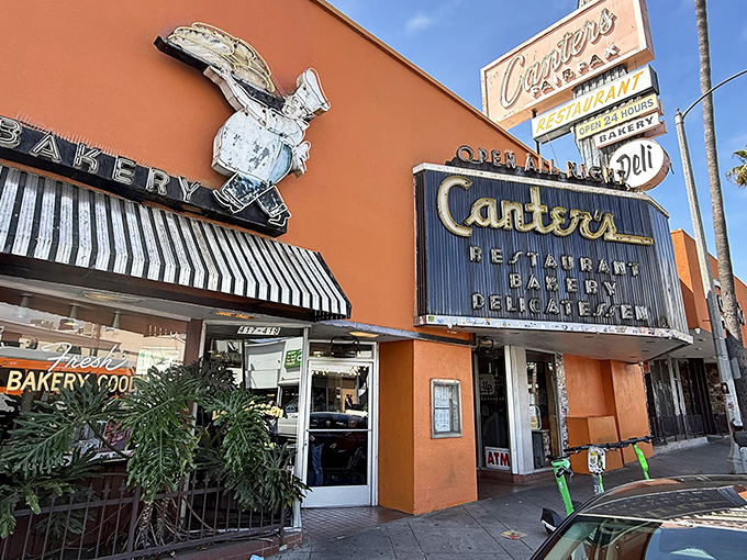The iconic orange facade of Canter's Deli stands out on Fairfax Avenue like a beacon of culinary nostalgia, promising comfort food that transcends trends.