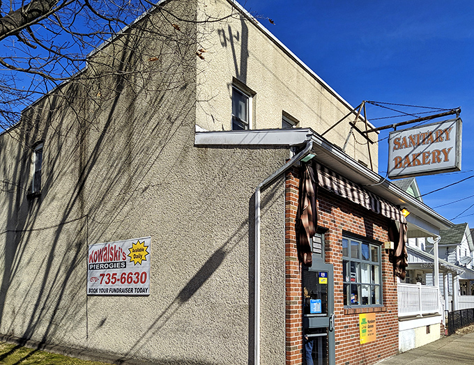 The unassuming brick-and-stucco exterior of Sanitary Bakery stands like a sweet sentinel in Nanticoke, promising delicious treasures within. No fancy frills needed.
