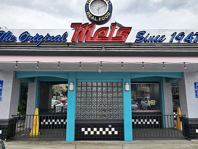 The neon sign at The Original Mels Diner glows like a beacon of comfort food, promising nostalgic flavors and that unmistakable diner hospitality.