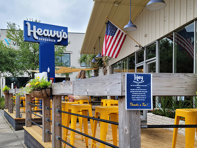 The outdoor deck with its cheerful yellow stools invites you to soak up Charleston sunshine while anticipating burger bliss.