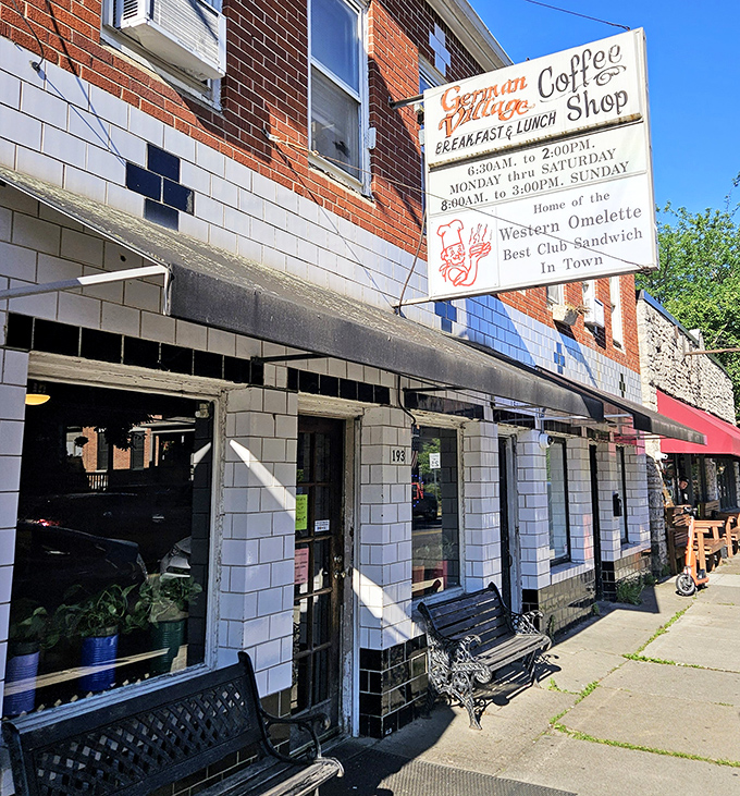 Sunlight dances across the vintage sign promising the "Best Club Sandwich In Town" &ndash; a bold claim this humble diner actually delivers on.