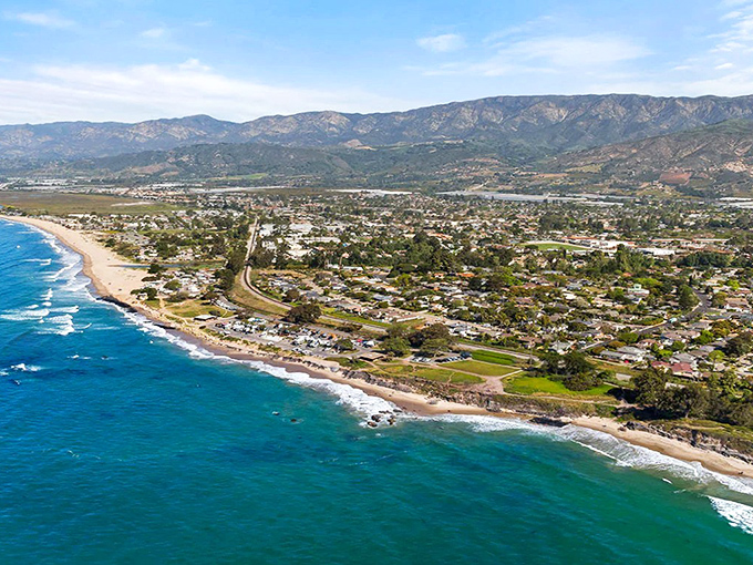 Carpinteria's coastline stretches like nature's welcome mat, where beachfront homes and mountain views create California's perfect postcard moment.