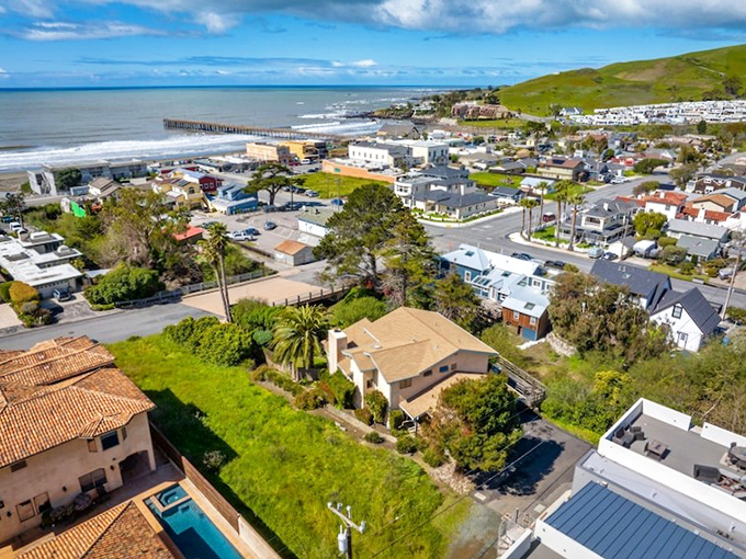 Cayucos from above &ndash; where California coastal dreams come with a side of small-town charm and the Pacific serves as nature's ultimate infinity pool.