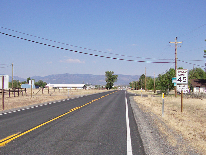 The open road beckons with mountains on the horizon. In Alturas, even the speed limit signs seem to be saying "slow down and enjoy life."