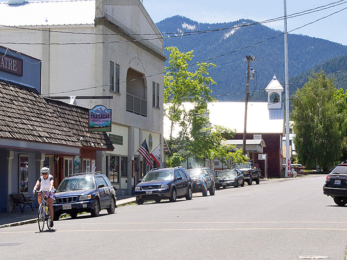 Etna unfolds like a storybook town nestled in nature's embrace, where mountains stand guard over rooftops that have witnessed generations of simpler living.