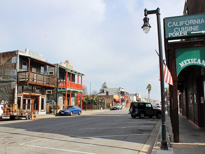 Historic buildings line Isleton's Main Street, where colorful facades and second-story balconies whisper stories of the town's Asian immigrant heritage.