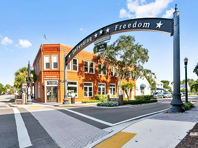 The "Defending Freedom" arch welcomes visitors to downtown Dunedin, where brick streets and historic buildings create that perfect small-town Florida charm.