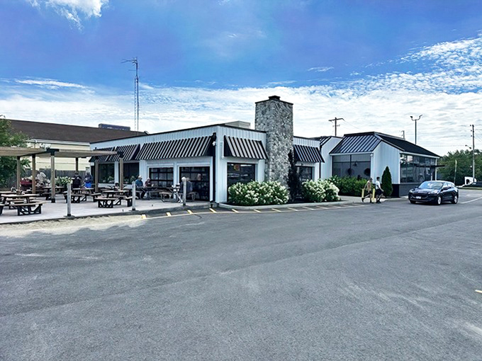 The unassuming exterior of Jolly Rogers Seafood House stands like a beacon for hungry travelers, promising Lake Erie's finest treasures within those white walls.