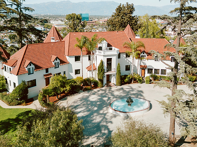 Fairy tales come to life at Wrensmoor Castle, where terracotta turrets and white walls create a European fantasy against the San Gabriel Mountains backdrop.