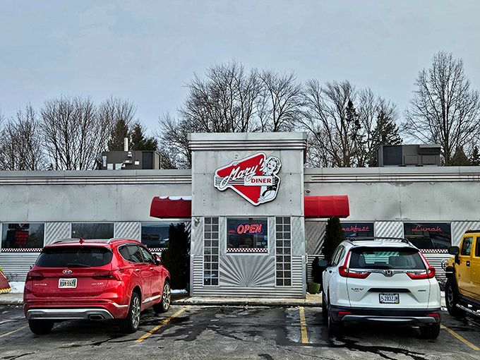 The classic Americana exterior of Mary's Diner stands like a time portal to the 1950s, complete with that iconic red and white signage that practically screams "comfort food inside!"