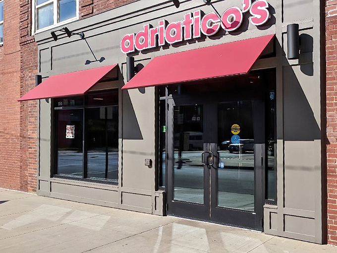The iconic red awnings of Adriatico's beckon pizza lovers like a lighthouse guides ships &ndash; a beacon of cheesy hope on the Columbus landscape.