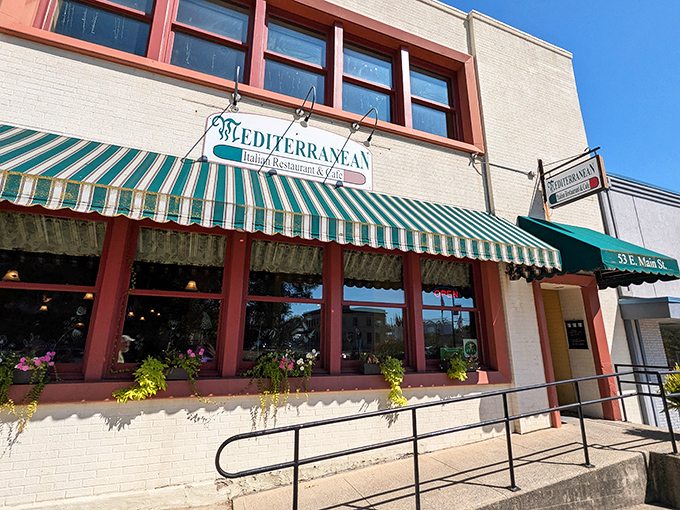 The iconic green and white striped awning of The Mediterranean is like a beacon for hungry travelers on Wilmington's Main Street, promising authentic flavors behind its modest fa&ccedil;ade.