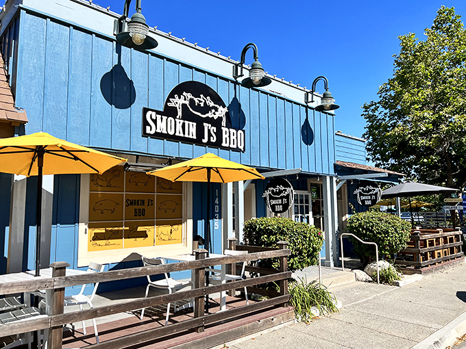 The blue beacon of barbecue bliss beckons hungry travelers. Yellow umbrellas promise sunshine even on cloudy days at this Poway smoke palace.