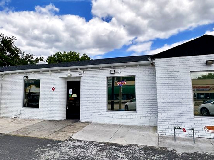 A simple white brick facade belies the culinary treasures within. This unassuming storefront houses some of Orlando's most talked-about pastries.