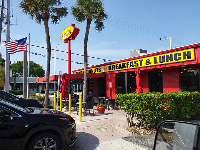 Morning sunshine meets donut paradise. The bright facade practically screams "Yes, you deserve this!" to everyone driving by.