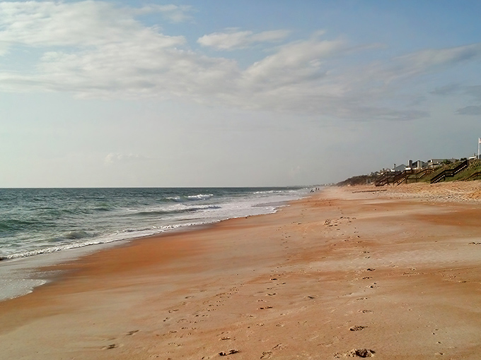 Nature's perfect postcard: pristine white sand dunes meet the endless blue Atlantic, with sea oats dancing in the breeze like nature's own welcome committee.