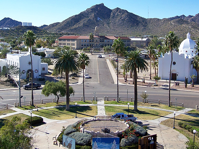 The Immaculate Conception Catholic Church stands like a pristine wedding cake against Ajo's rugged mountains, proving that desert architecture doesn't have to be fifty shades of beige.