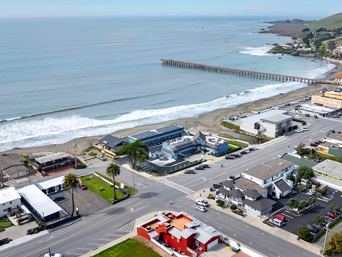 Cayucos stretches along the coastline like a postcard come to life, with its iconic pier reaching into the Pacific like nature's welcome mat.