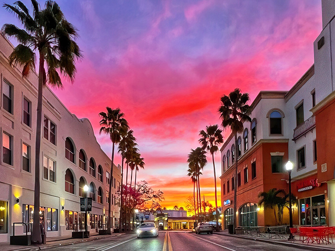 Main Street at sunset looks like a movie set where palm trees stand guard over colorful buildings. Even the sky puts on a show here.