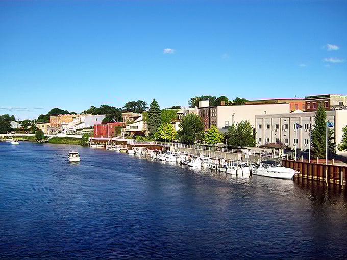 Boats bob gently along Manistee's riverfront on a perfect summer day, proving that sometimes the best skyline isn't made of skyscrapers.