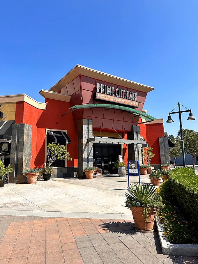 The vibrant terracotta exterior of Prime Cut Caf&eacute; stands out like a culinary beacon in Orange, promising delicious adventures within those walls.