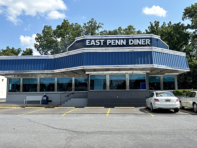 The iconic blue-roofed East Penn Diner stands proudly in Emmaus, its packed parking lot a testament to what awaits inside. Pennsylvania's answer to comfort food paradise.