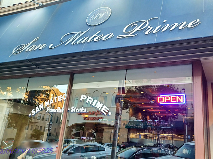 The blue awning and elegant script of San Mateo Prime beckons like a culinary lighthouse on 3rd Avenue, promising meaty treasures within.