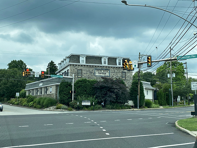 The historic stone edifice of Spring House Tavern stands proudly at the intersection, a culinary landmark that's been beckoning hungry travelers for generations.