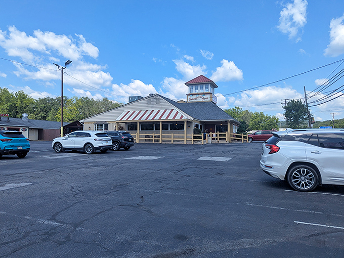 The lighthouse-inspired cupola atop Smuggler's Cove stands as a beacon for hungry travelers. Maritime charm meets mountain hospitality in Tannersville.