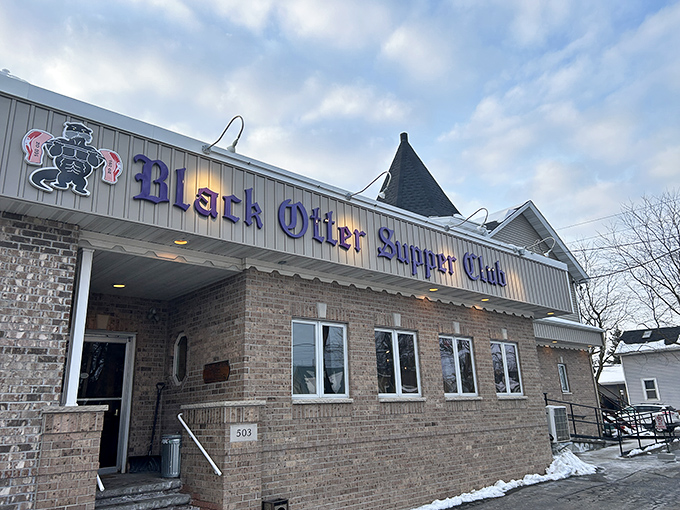 The brick facade of Black Otter Supper Club stands as a beacon of comfort in Hortonville, promising Wisconsin traditions and prime rib perfection behind those doors.
