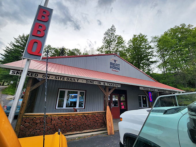 The red BBQ sign stands like a lighthouse for hungry travelers, promising smoky salvation in the Pennsylvania countryside.