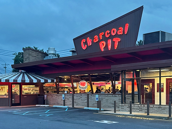 The neon glow of Charcoal Pit's iconic sign has been beckoning hungry Delawareans since the Eisenhower administration, a retro beacon of culinary comfort.