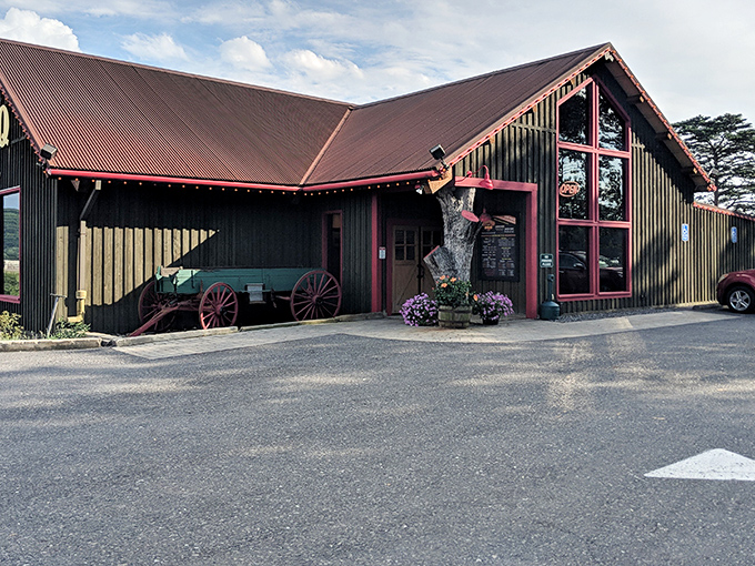 Rustic charm meets serious BBQ business at Skeeter's exterior, where that red-trimmed wooden structure promises smoky delights within.