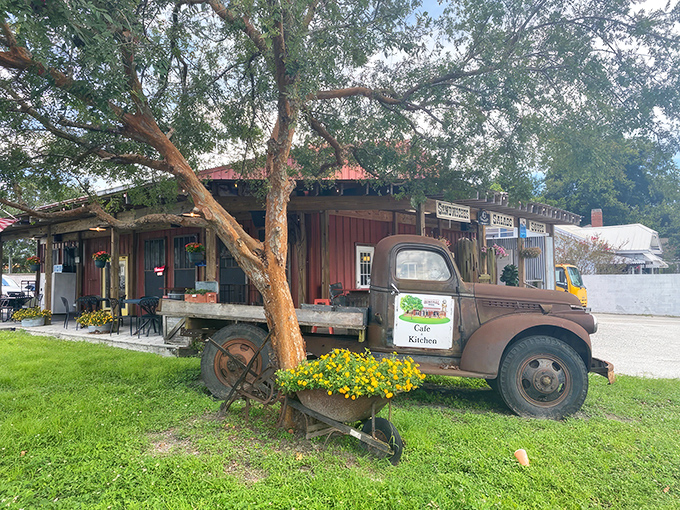 A vintage truck parked outside this rustic red building isn't just decoration&mdash;it's a time machine to when general stores were the heart of every neighborhood.