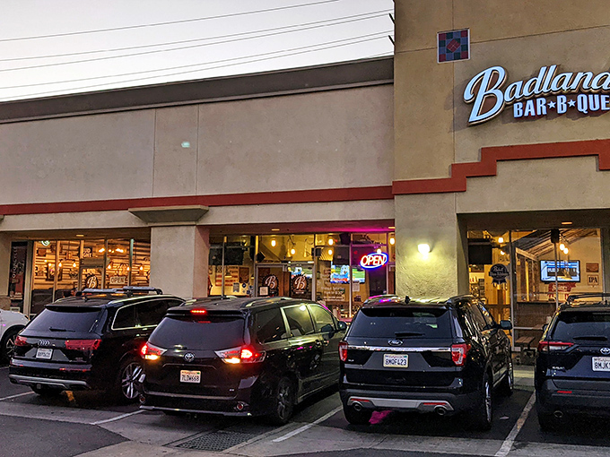 Unassuming strip mall exterior by day, barbecue paradise by night. The best culinary treasures often hide in plain sight.