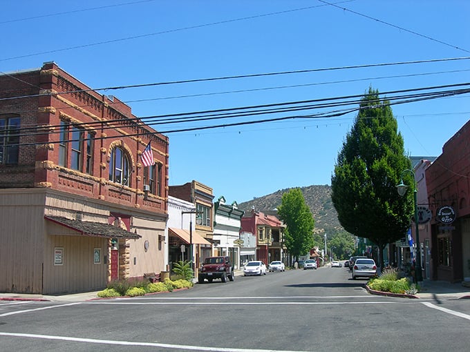 Miner Street stretches toward the mountains like a postcard from simpler times, where parking spots outnumber traffic jams and the pace slows to human scale.