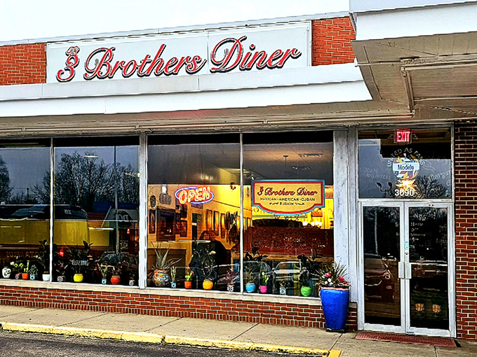 The red script signage of 3 Brothers Diner glows like a beacon against the brick exterior, promising comfort food salvation to hungry Grove City travelers.