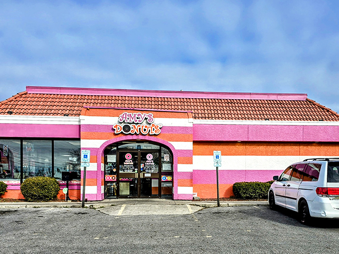 The pink and orange striped exterior of Amy's Donuts isn't just a building&mdash;it's a mood-lifting promise of the sugary joy waiting inside.