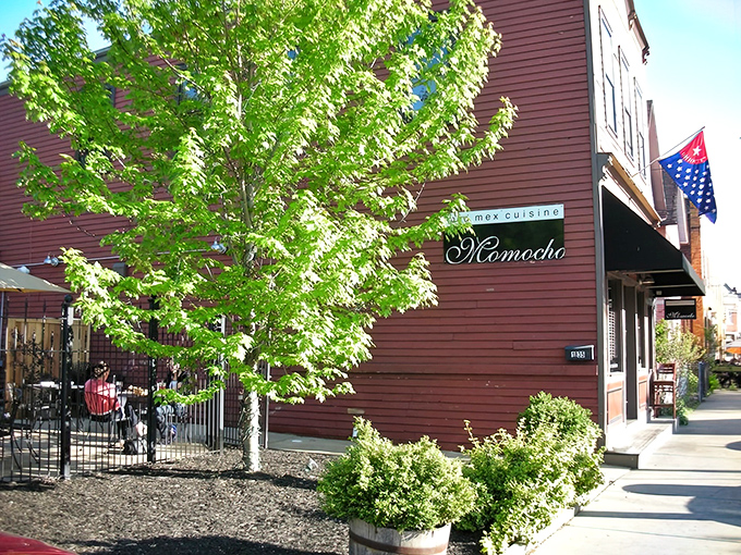Momocho's burgundy exterior stands like a culinary beacon in Ohio City, promising modern Mexican delights behind that elegant script signage.