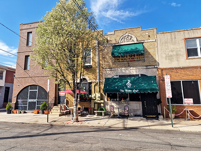 The iconic green awnings of Victor Caf&eacute; stand out on this South Philly street corner, promising musical and culinary delights within those brick walls.