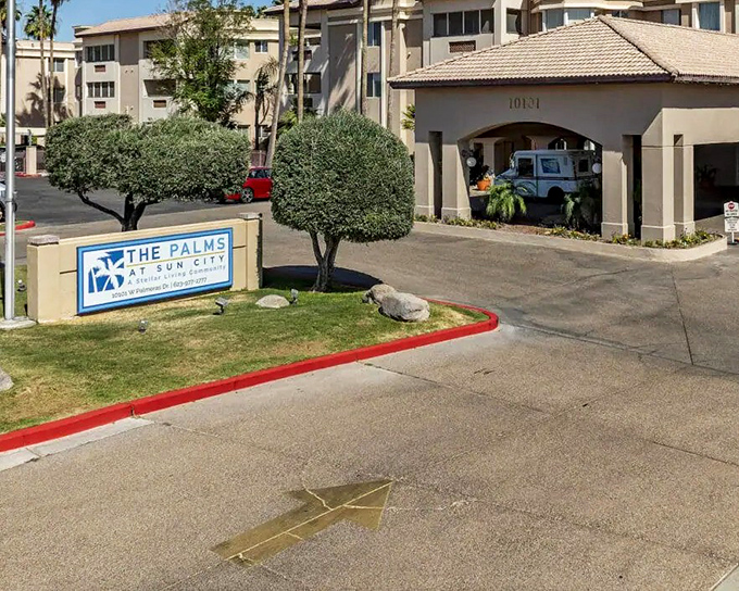 Paradise found! Sun City West's recreation center stands as the crown jewel of retirement living, where swimming pools and palm trees create an oasis in the desert.