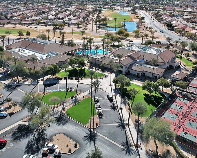 Paradise found! Sun City West's recreation center stands as the crown jewel of retirement living, where swimming pools and palm trees create an oasis in the desert.