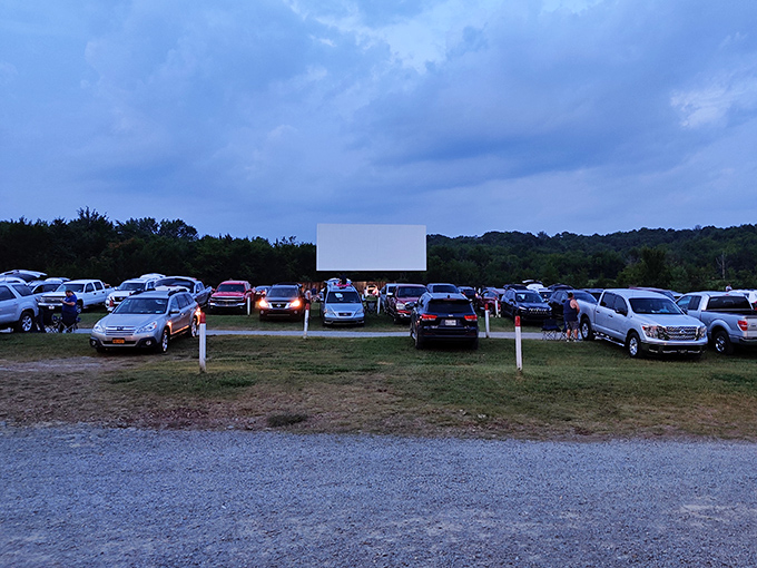 As twilight settles over Watertown, cars find their perfect viewing spots. There's something wonderfully democratic about everyone facing the same direction with the same anticipation.