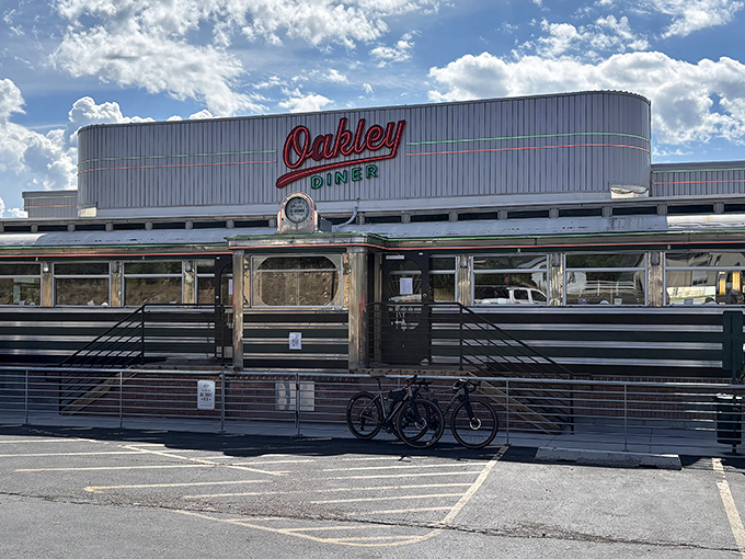 The gleaming stainless steel exterior of Oakley Diner stands like a time capsule against Utah's blue skies, beckoning hungry travelers with its classic Americana charm.