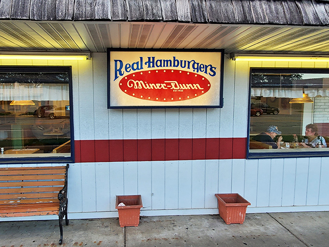 The iconic white and red exterior of Miner-Dunn proudly announces "Real Hamburgers" &ndash; a promise they've kept since Herbert Hoover was president.